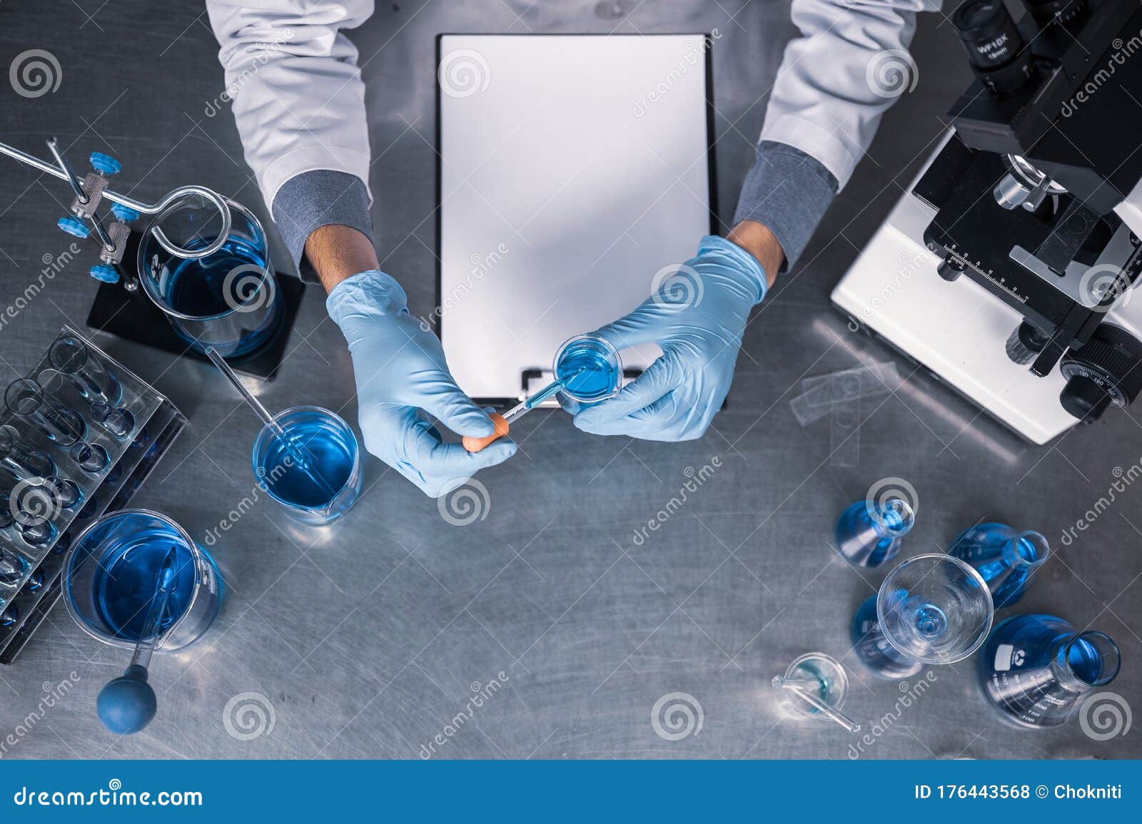 Top View Workspace in Laboratory with Microscope, Laptop, and ...