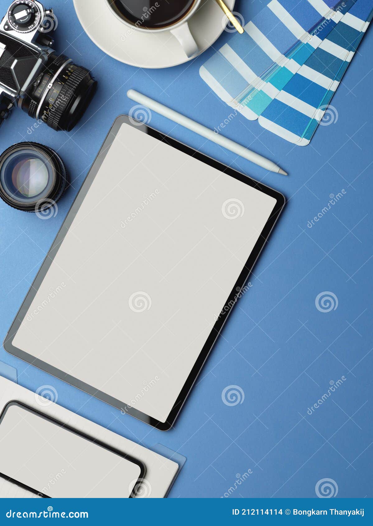 Top View of Worktable with Tablet, Smartphone, Camera and Supplies in ...