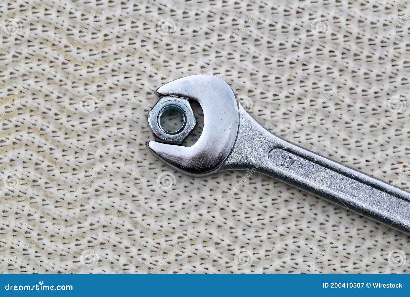 Top View Of A Wrench With A Nut Laid On The Table Stock Image ...