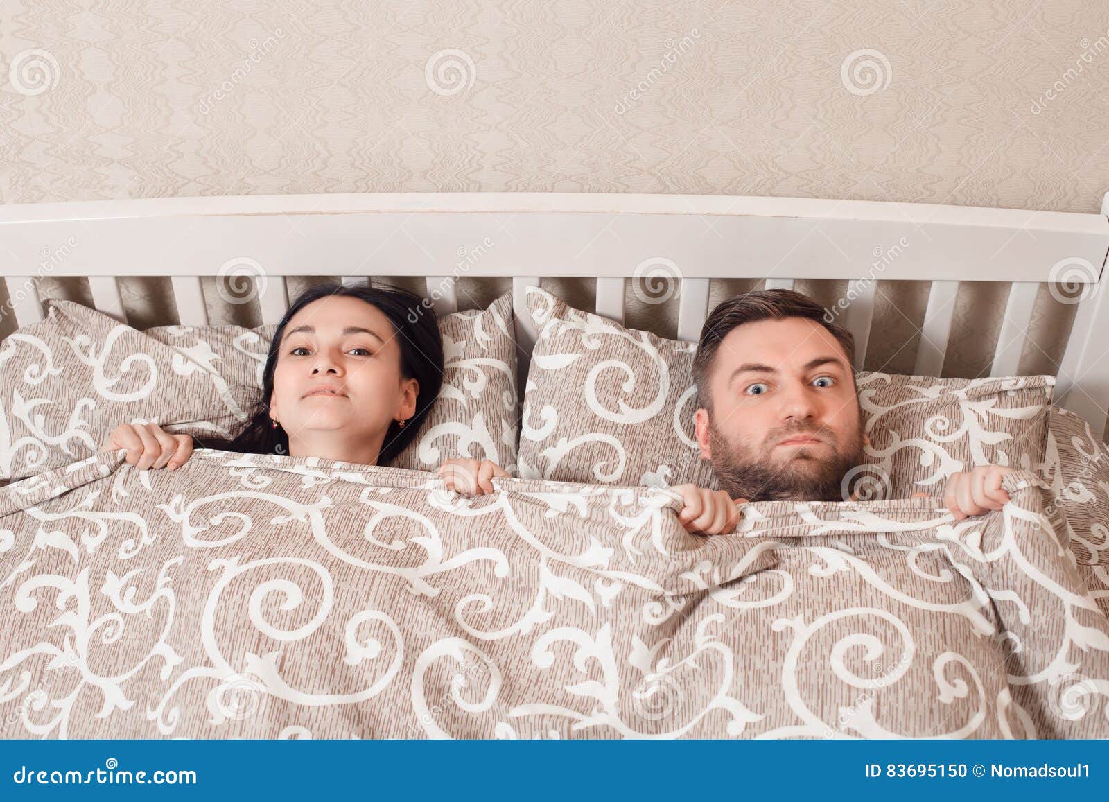 Top View of Young Couple Showing Surprise in Bed. Stock Photo - Image ...
