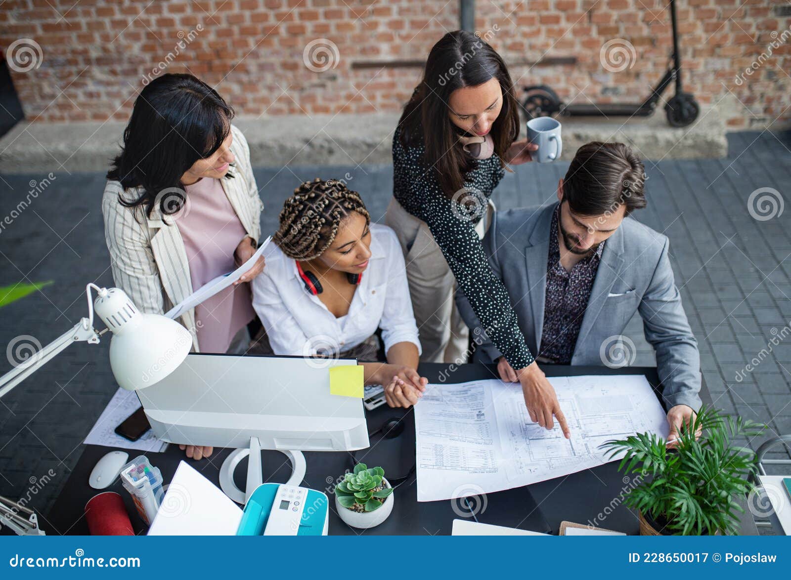 Top View of Young and Old Architects Sitting and Working at Desk in ...