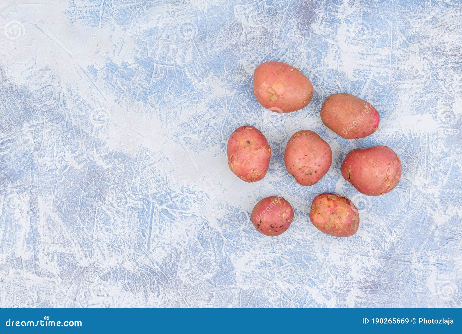 Top View of Young Red Potatoes on the Blue Background with Copy Space ...