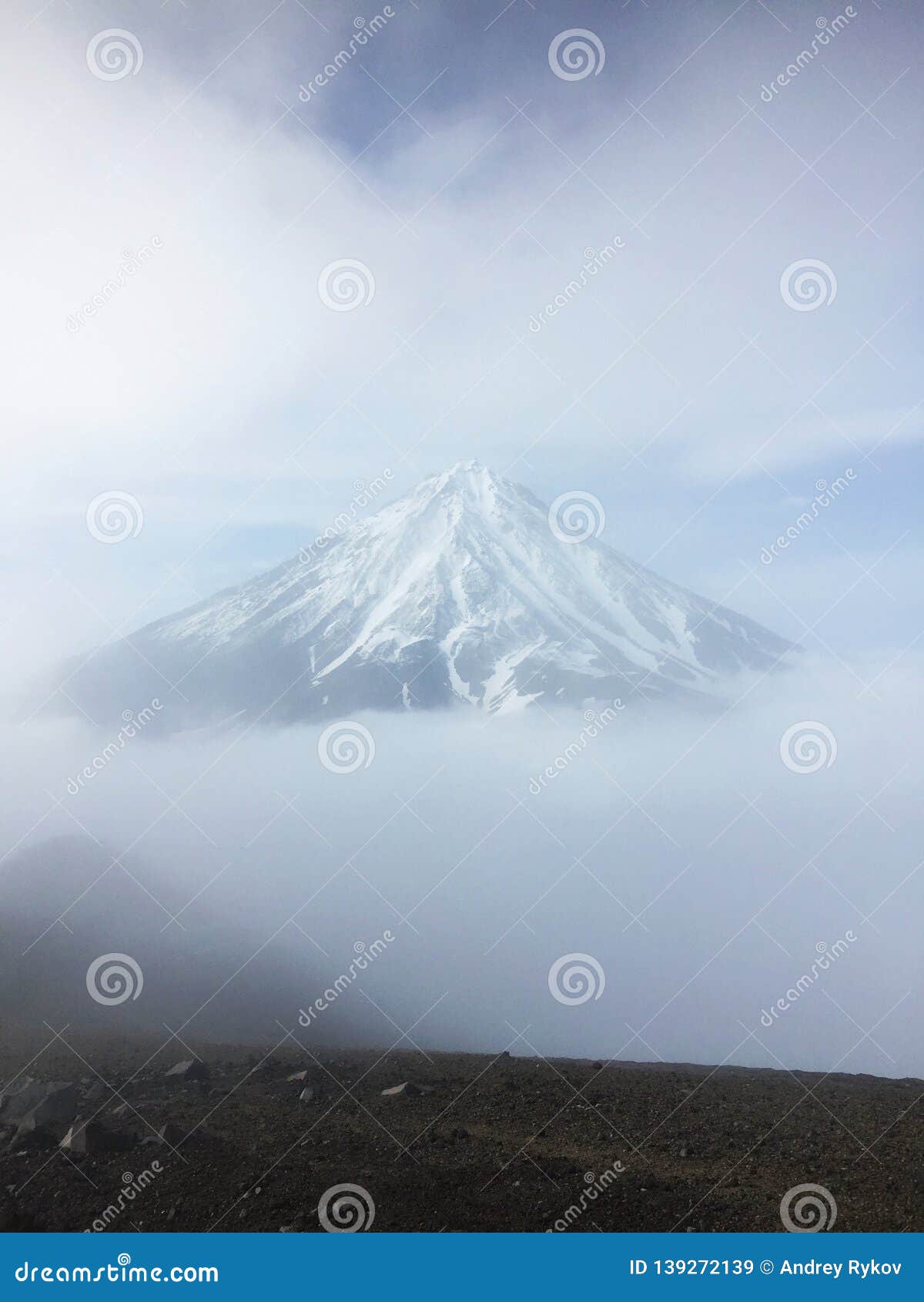The Top of the Volcano is Visible through the Clouds Stock Image ...