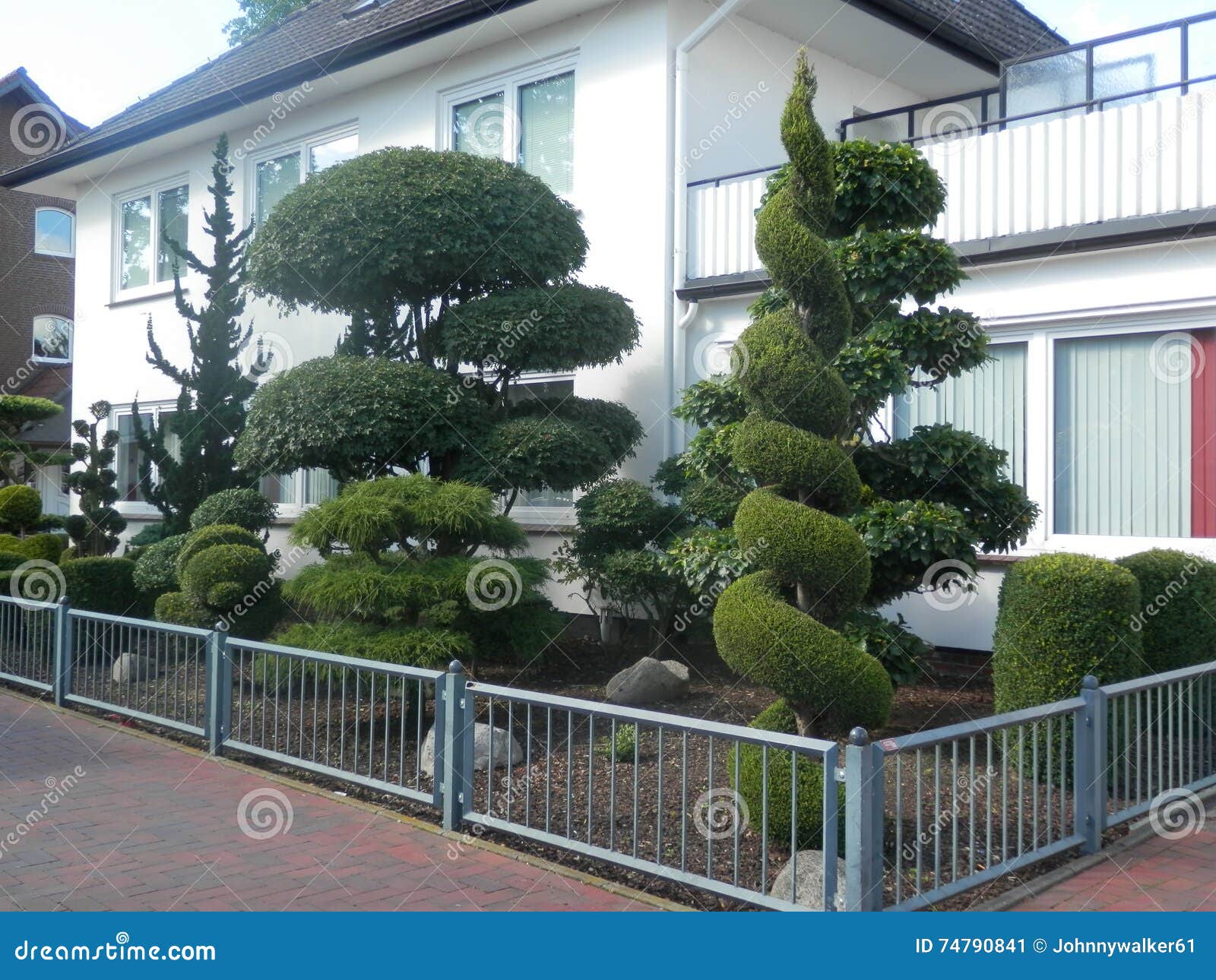 Topiary in Village Street stock image. Image of gardening - 74790841