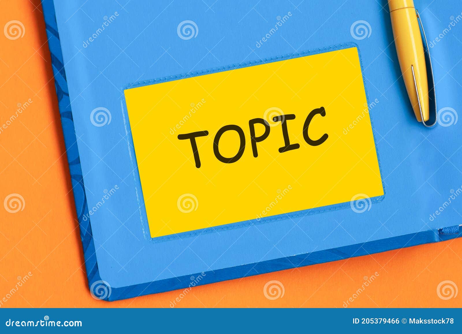 Topic the Word is Written in Black Letters on the Yellow Paper for ...