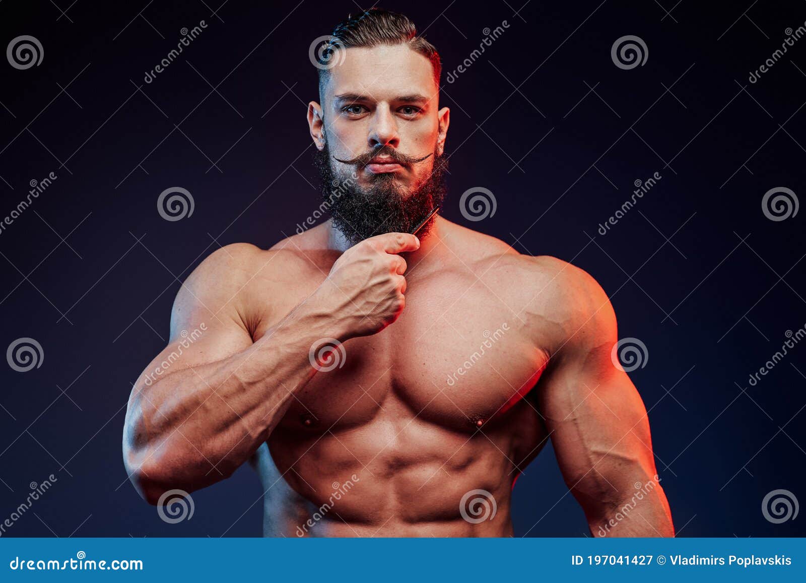 Topless Bodybuilder With Beard Posing In Dark Background Royalty-Free ...