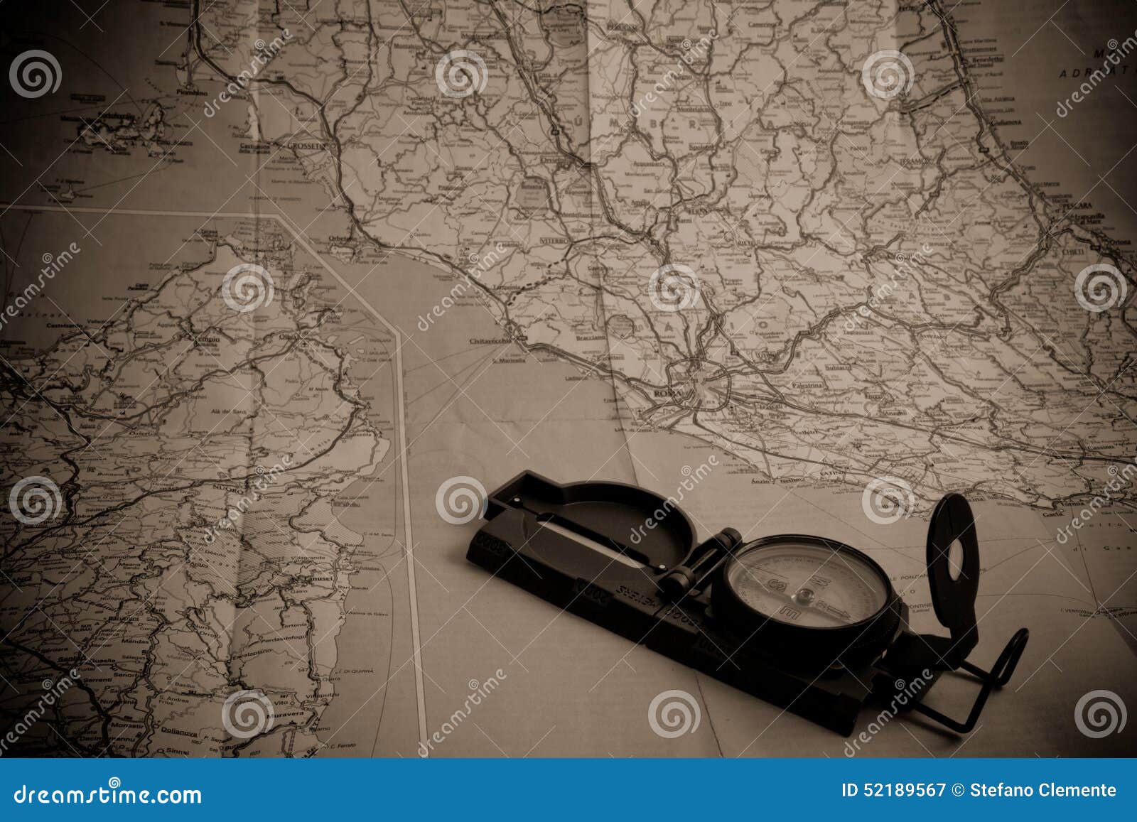 Topographic Map And Compass On Lichen-covered Rock. Navigation ...