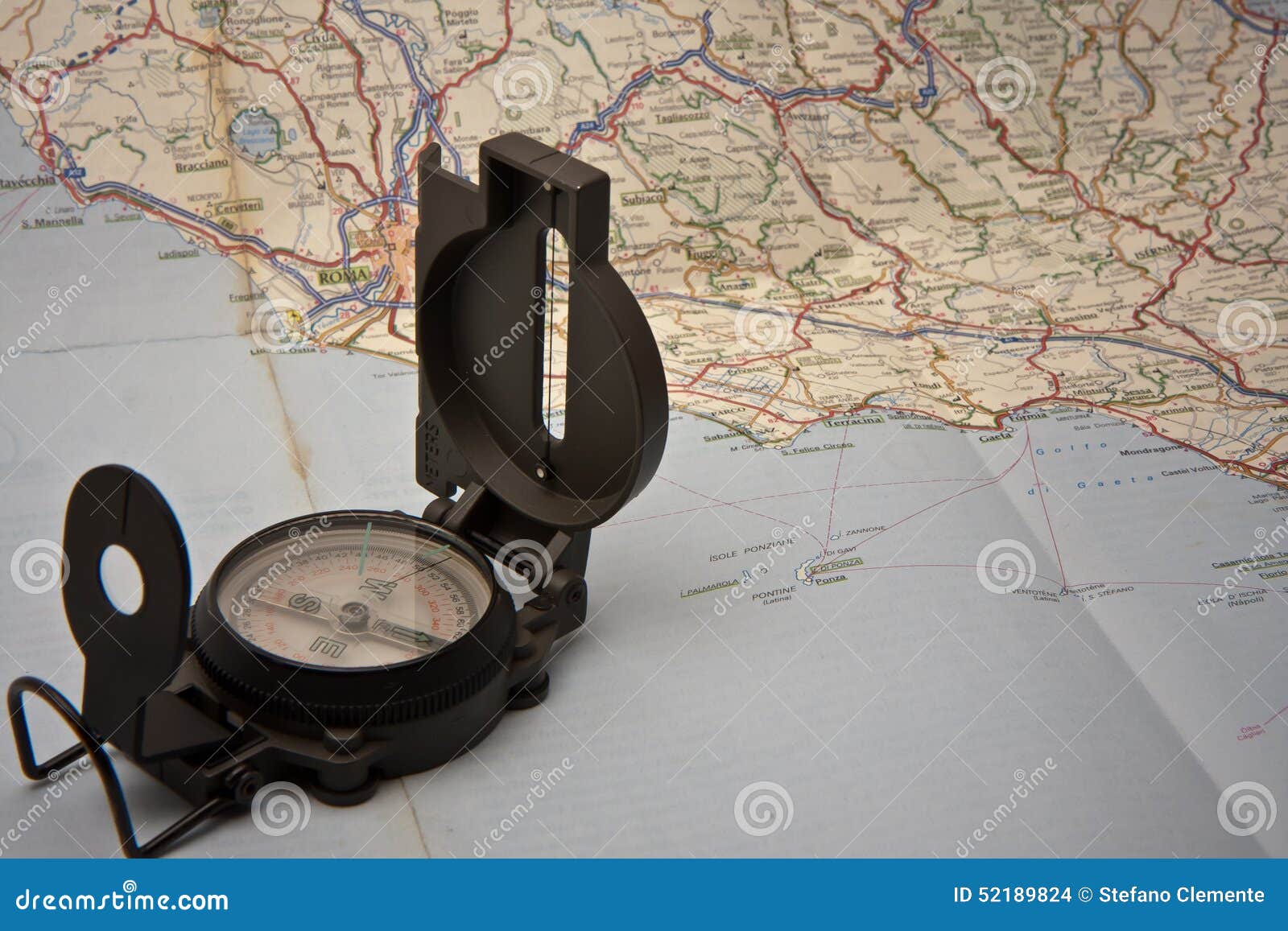 Topographic Map And Compass On Lichen-covered Rock. Navigation ...