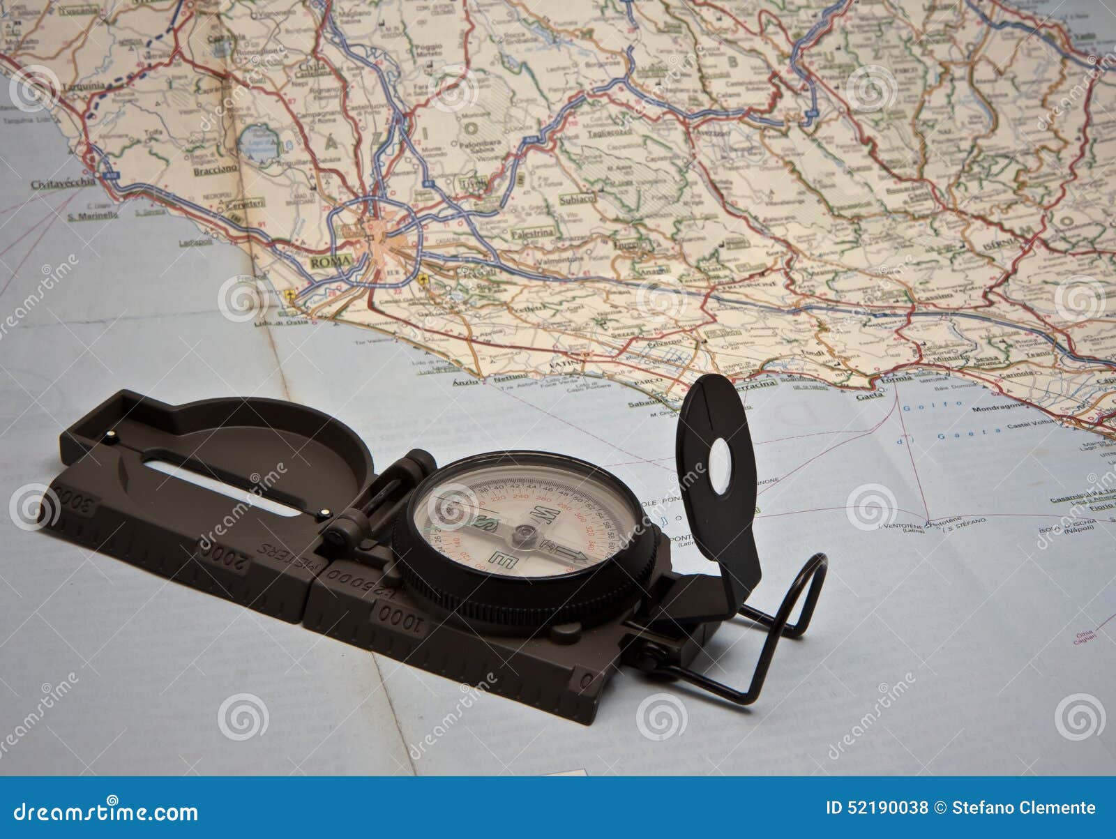 Topographic Map And Compass On Lichen-covered Rock. Navigation ...