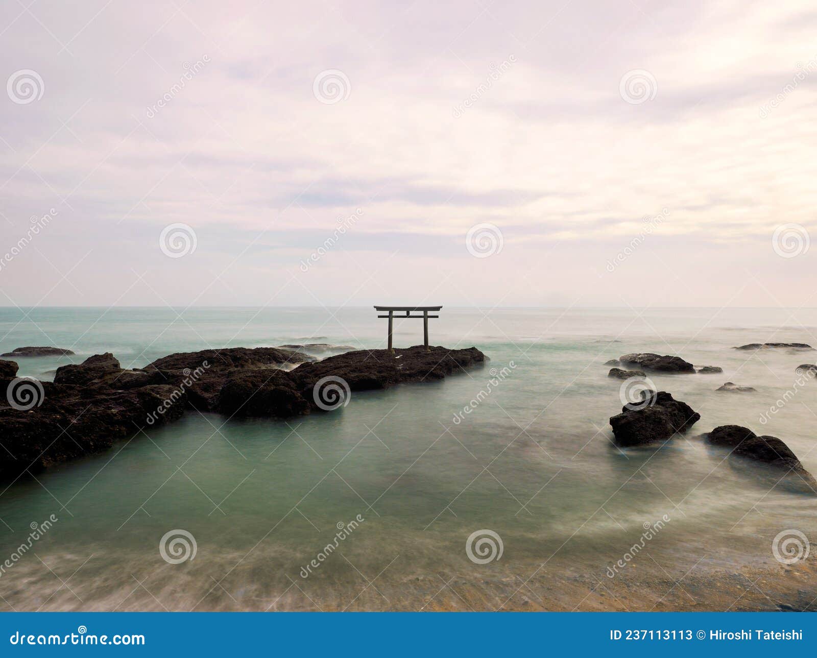 A Torii or a Shinto Gateway Shrine Gate on the Rock in the Sea Stock ...