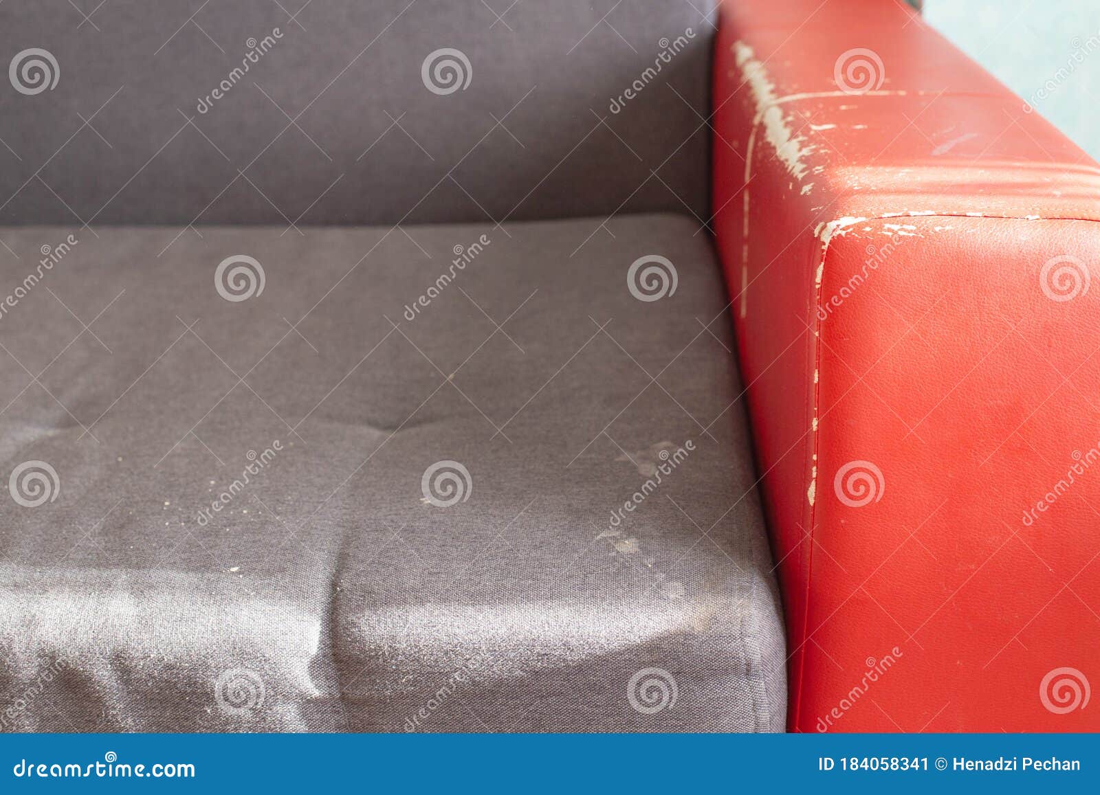 Torn and Battered Leather Back of the Sofa. Poor Quality Leather ...