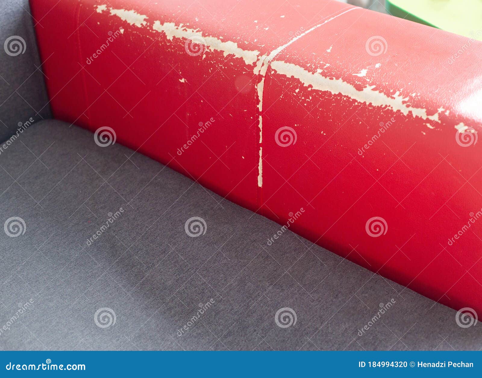 Torn and Battered Leather Back of the Sofa. Poor Quality Leather ...
