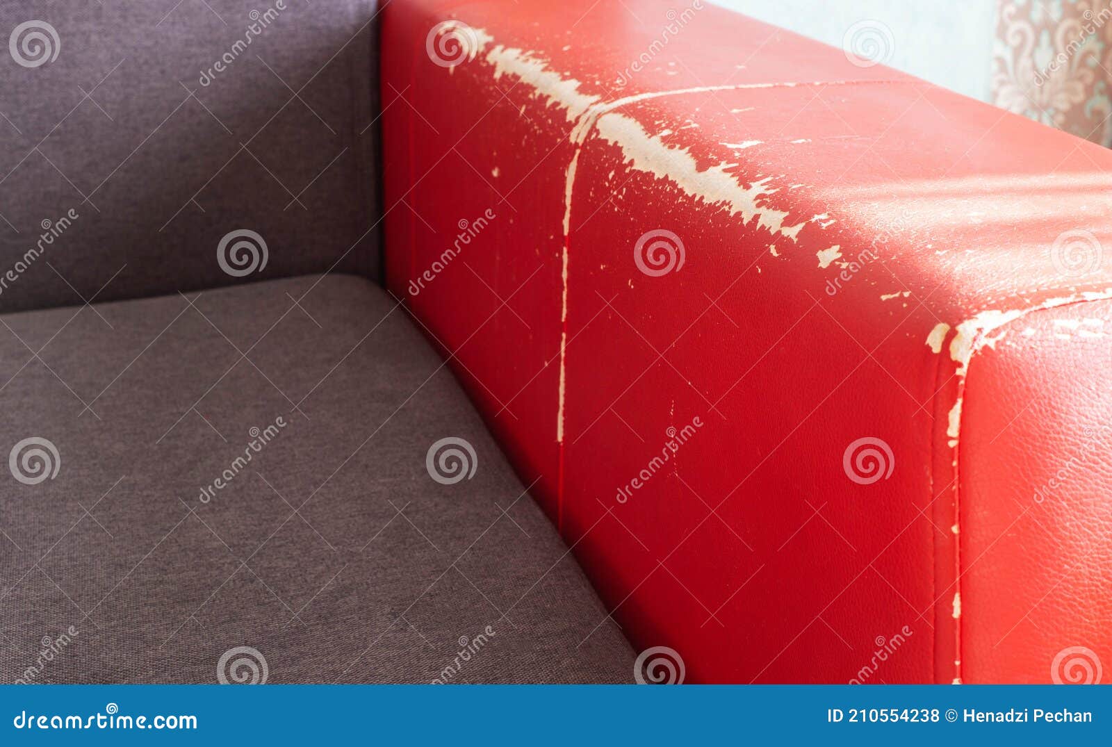 Torn and Battered Leather Back of the Sofa. Poor Quality Leather ...