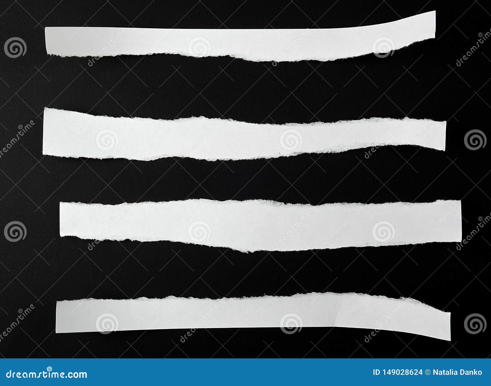 Torn Blank White Paper Strips Against a Black Background Stock Photo ...