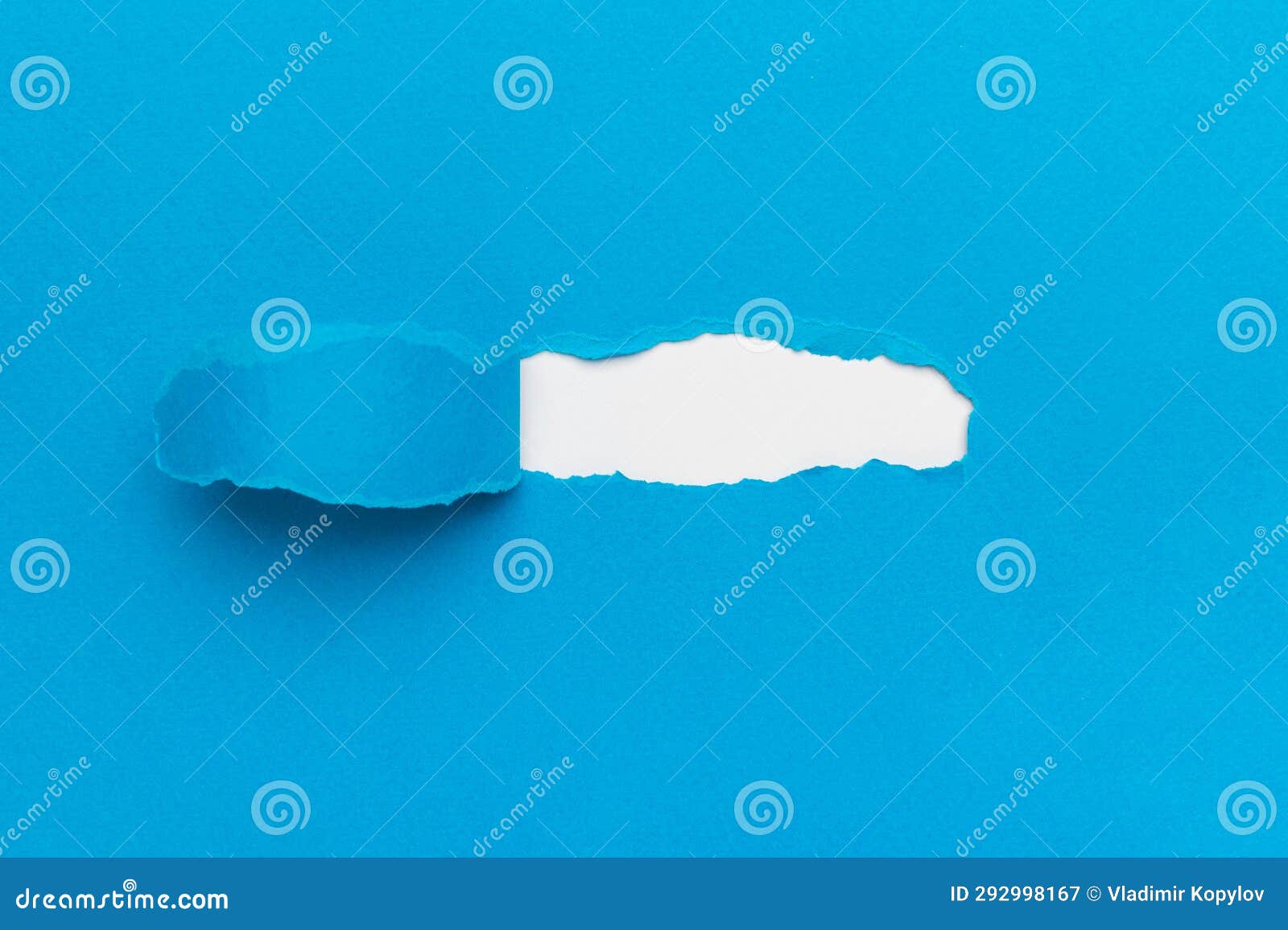 A Torn Blue Paper from Under Which a White One Peeks Out Stock Image ...