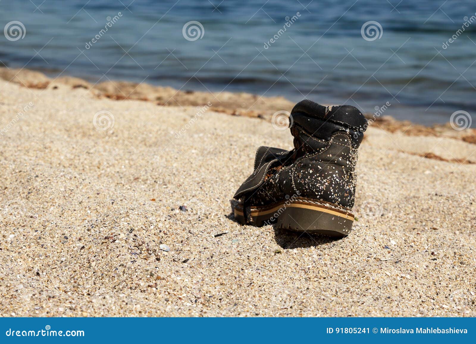 Torn boot on the beach stock image. Image of torn, dirty - 91805241