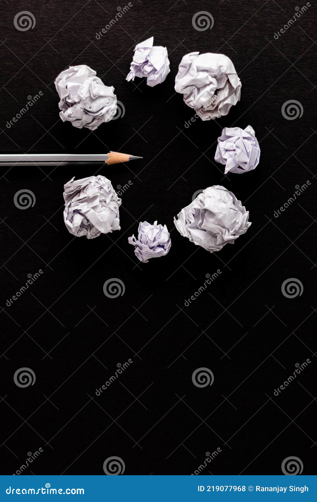 Torn and Crushed Paper Balls Arranged in Circular Pattern with a Pencil ...