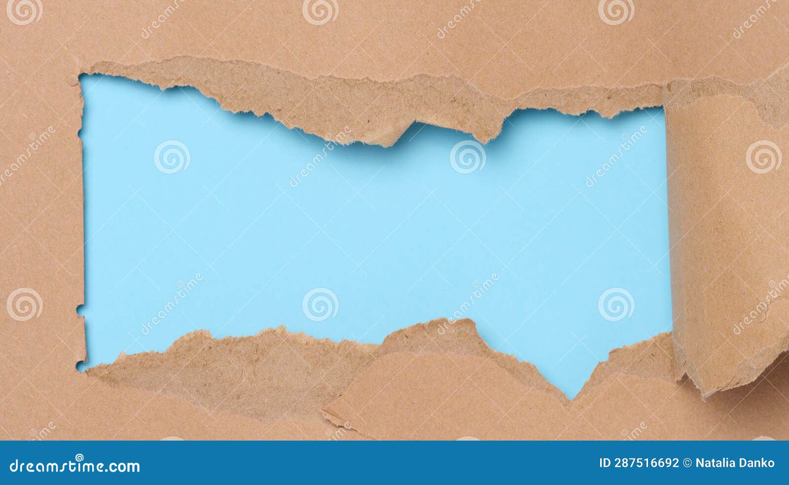 Torn Edges of Brown Paper on a Blue Background, Space for Writing Stock ...
