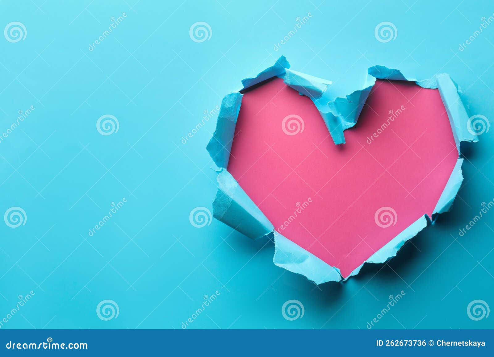 Torn Heart Shaped Hole in Light Blue Paper on Pink Background, Space ...