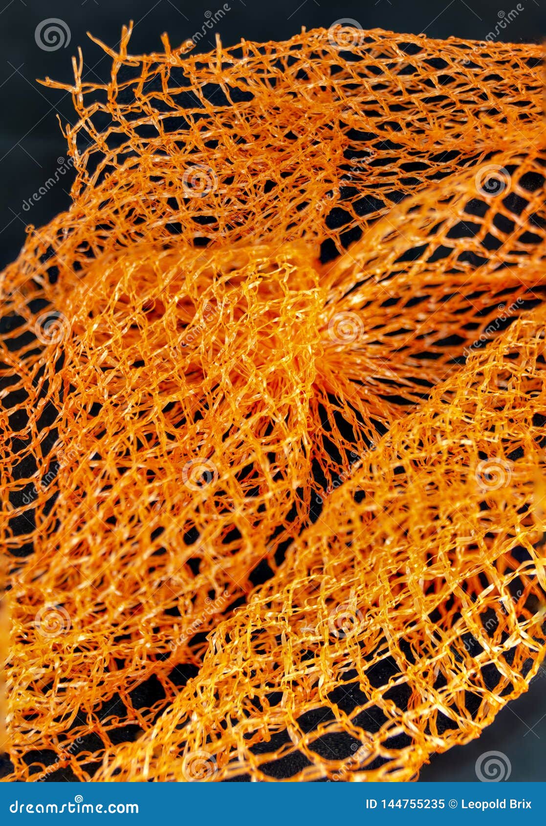 Torn orange mesh stock image. Image of meshes, refuse - 144755235