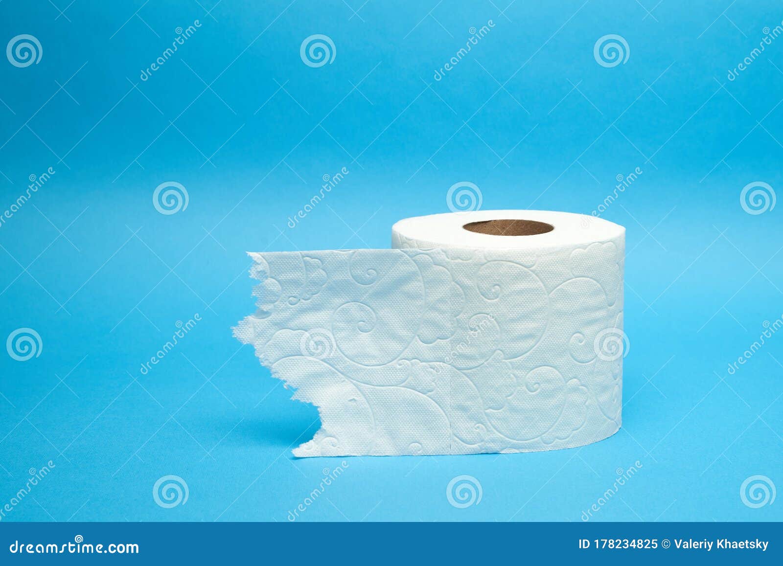 Torn Off White Toilet Paper Roll on Minimalistic Blue Background Stock ...