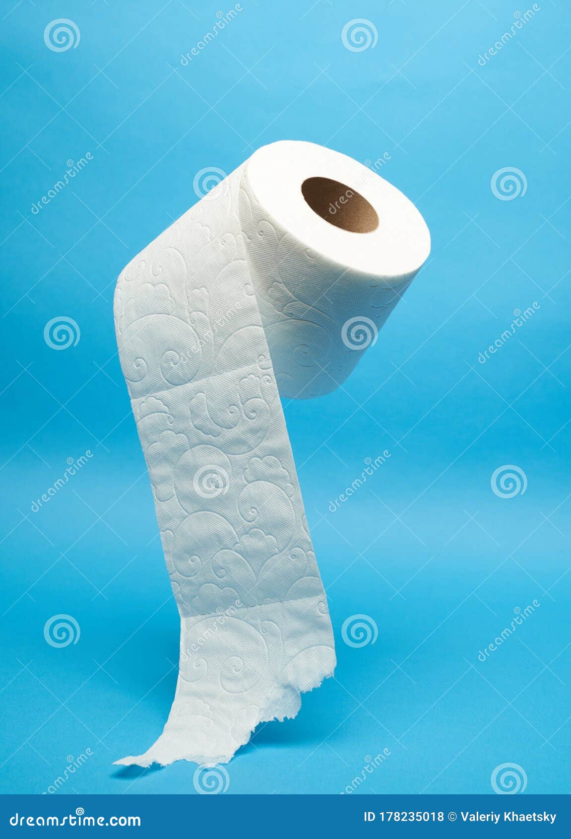 Torn Off White Toilet Paper Roll on Minimalistic Blue Background Stock ...