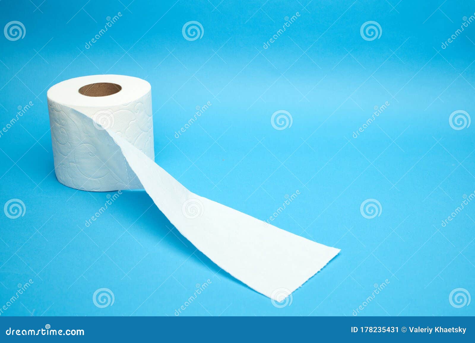 Torn Off White Toilet Paper Roll on Minimalistic Blue Background Stock ...