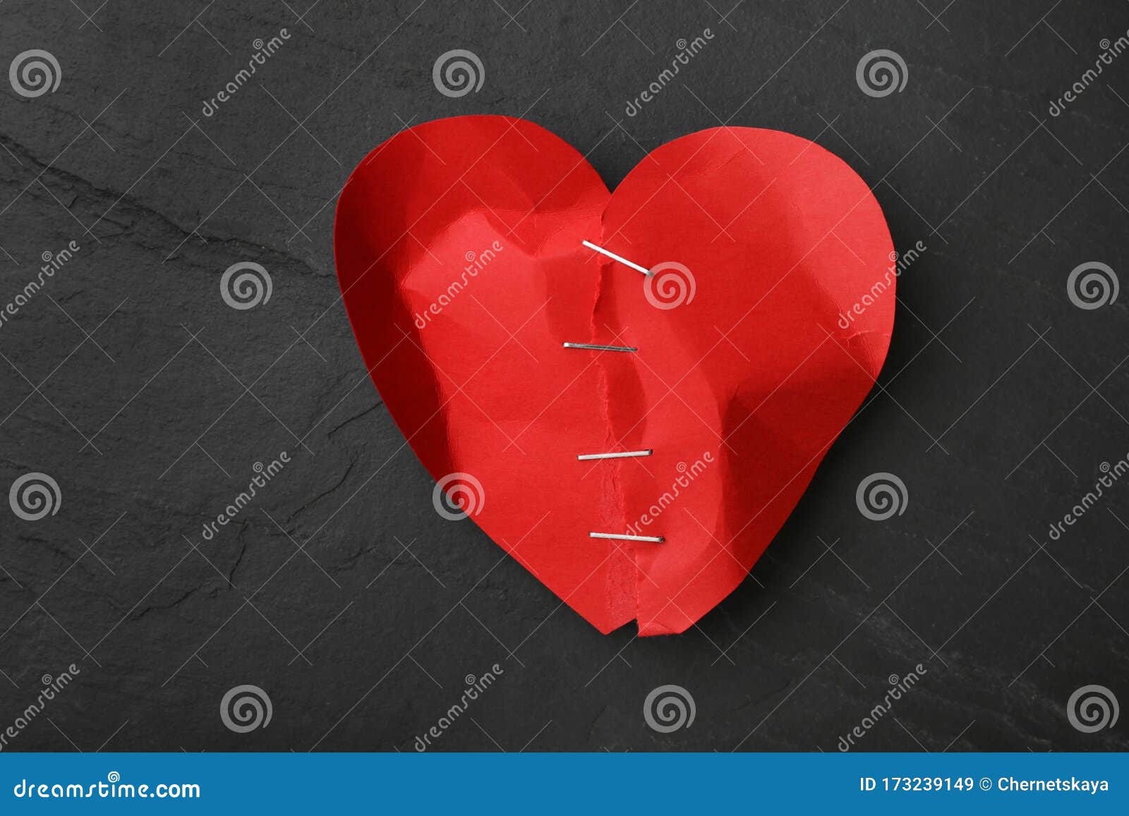 Torn Paper Heart with Staples on Black Stone Background, Top View ...