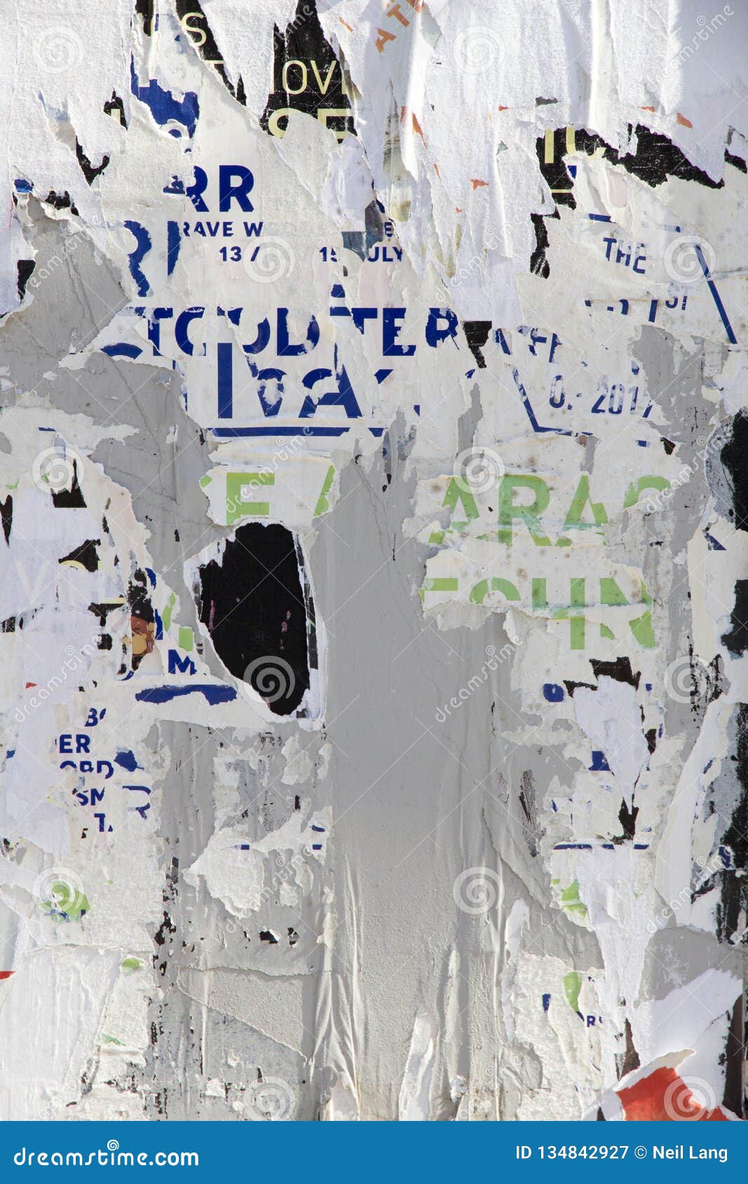 Torn posters on billboard stock image. Image of crease - 134842927