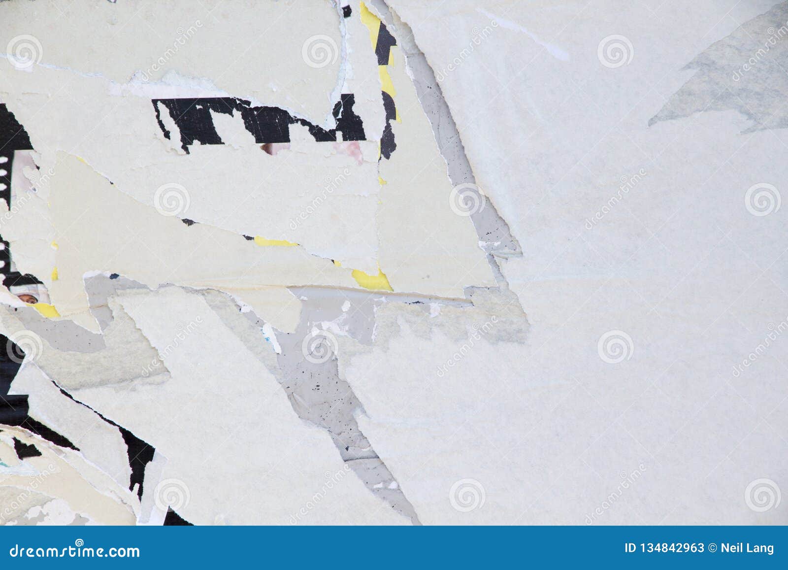 Torn posters on billboard stock image. Image of graphic - 134842963