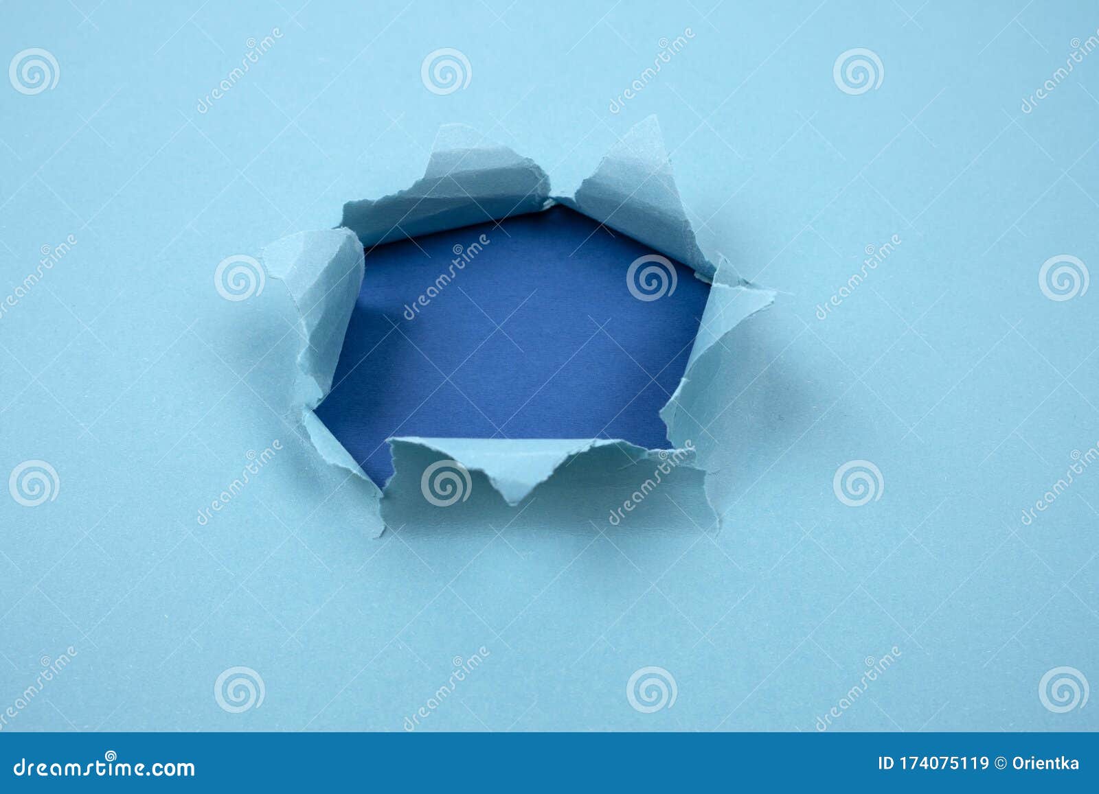 Torn Round Hole in Cyan Blue Paper with Torn Edges and a Blue ...