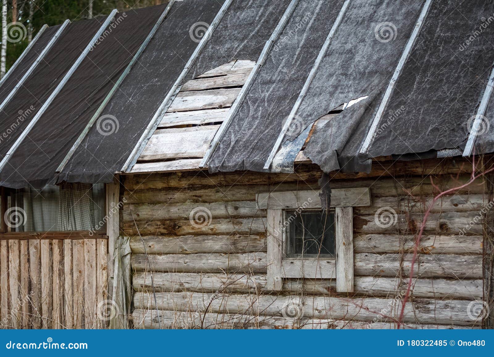 Torn Ruberoid Roofing Material on the Roof of the House Stock Image ...