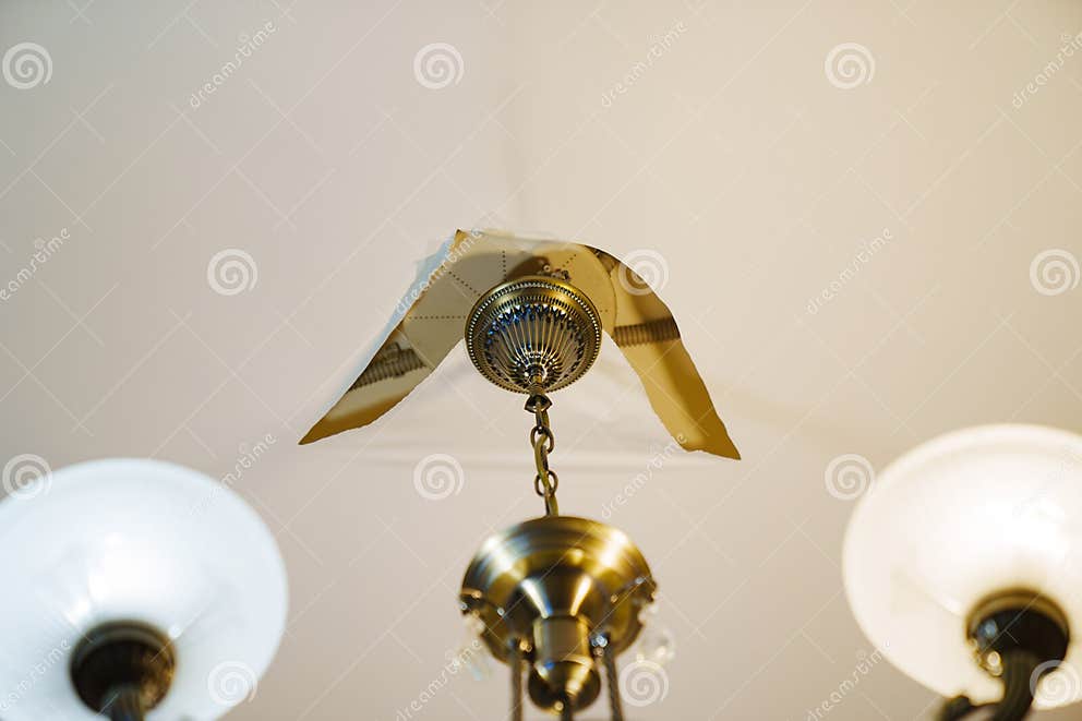 A Torn Stretch Ceiling with a Ceiling Lamp Stock Photo - Image of home ...