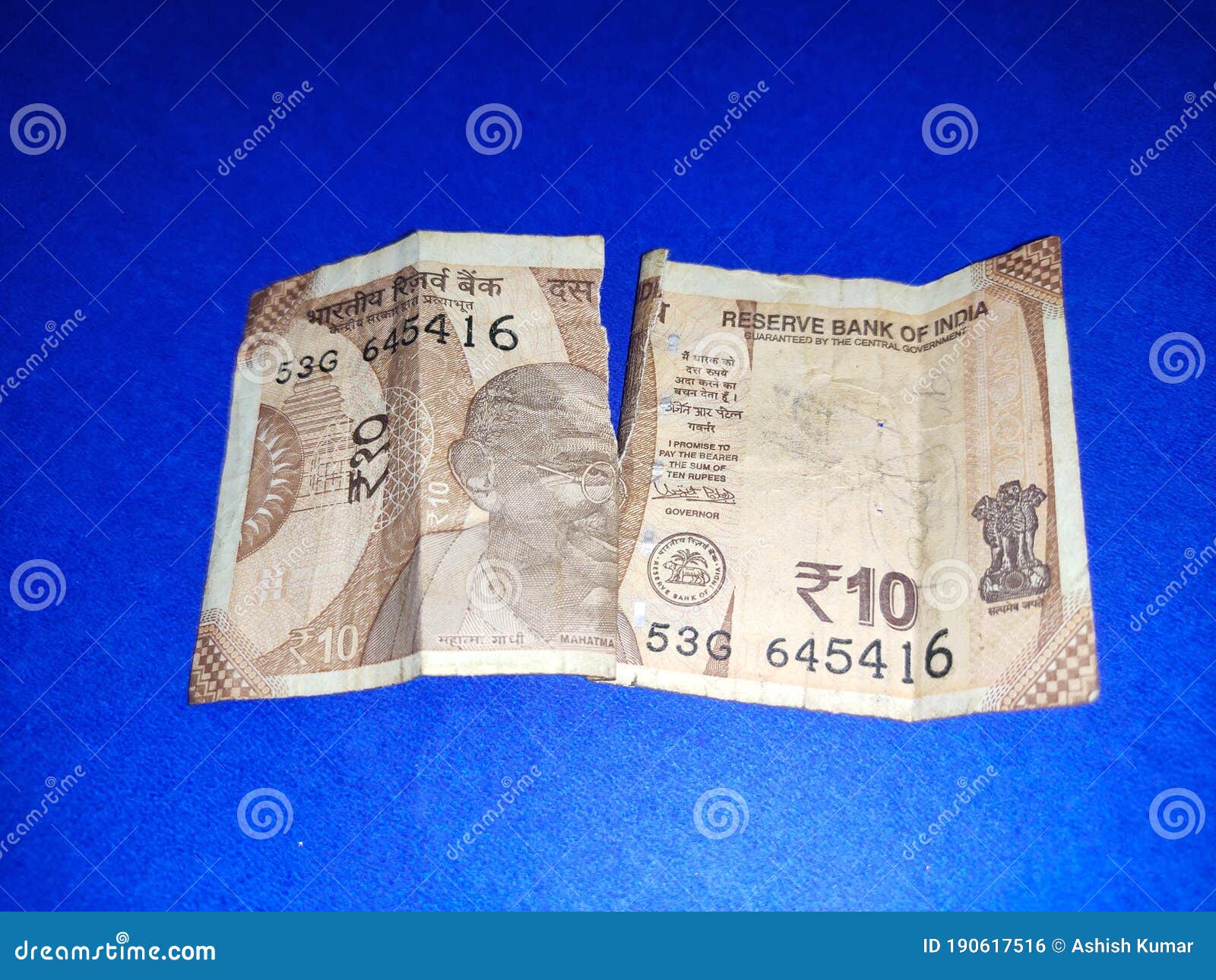 Torn Ten Rupees Indian Note on Blue Background Isolated Stock Photo ...
