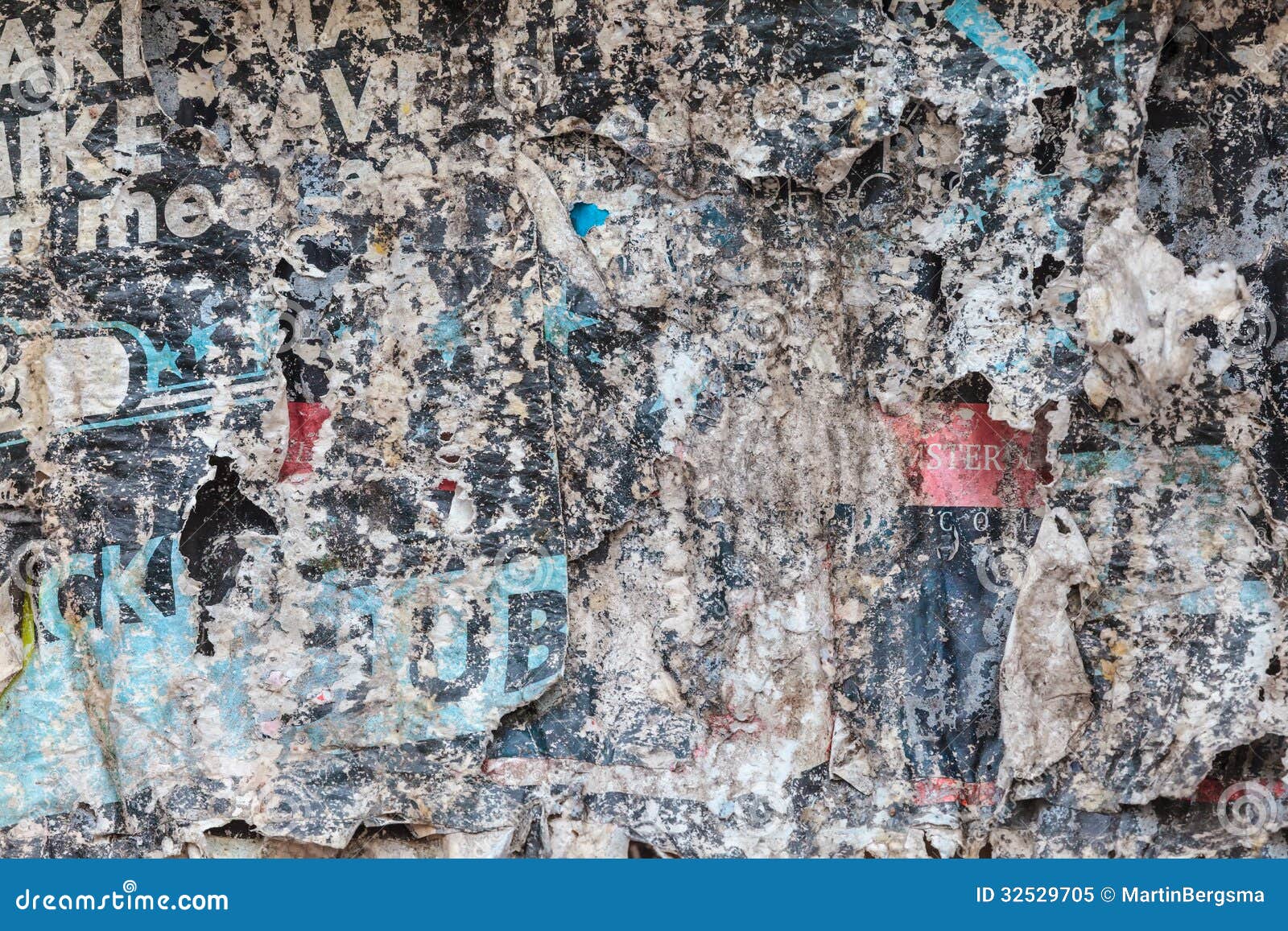 Torn and Weathered Advertisement Posters on a Wall Stock Image - Image ...