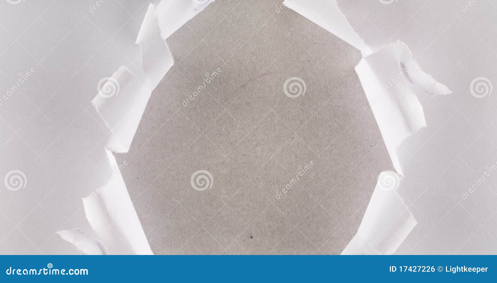 Torn Wrapping Paper Revealing Cardboard Box Stock Photo - Image of ...