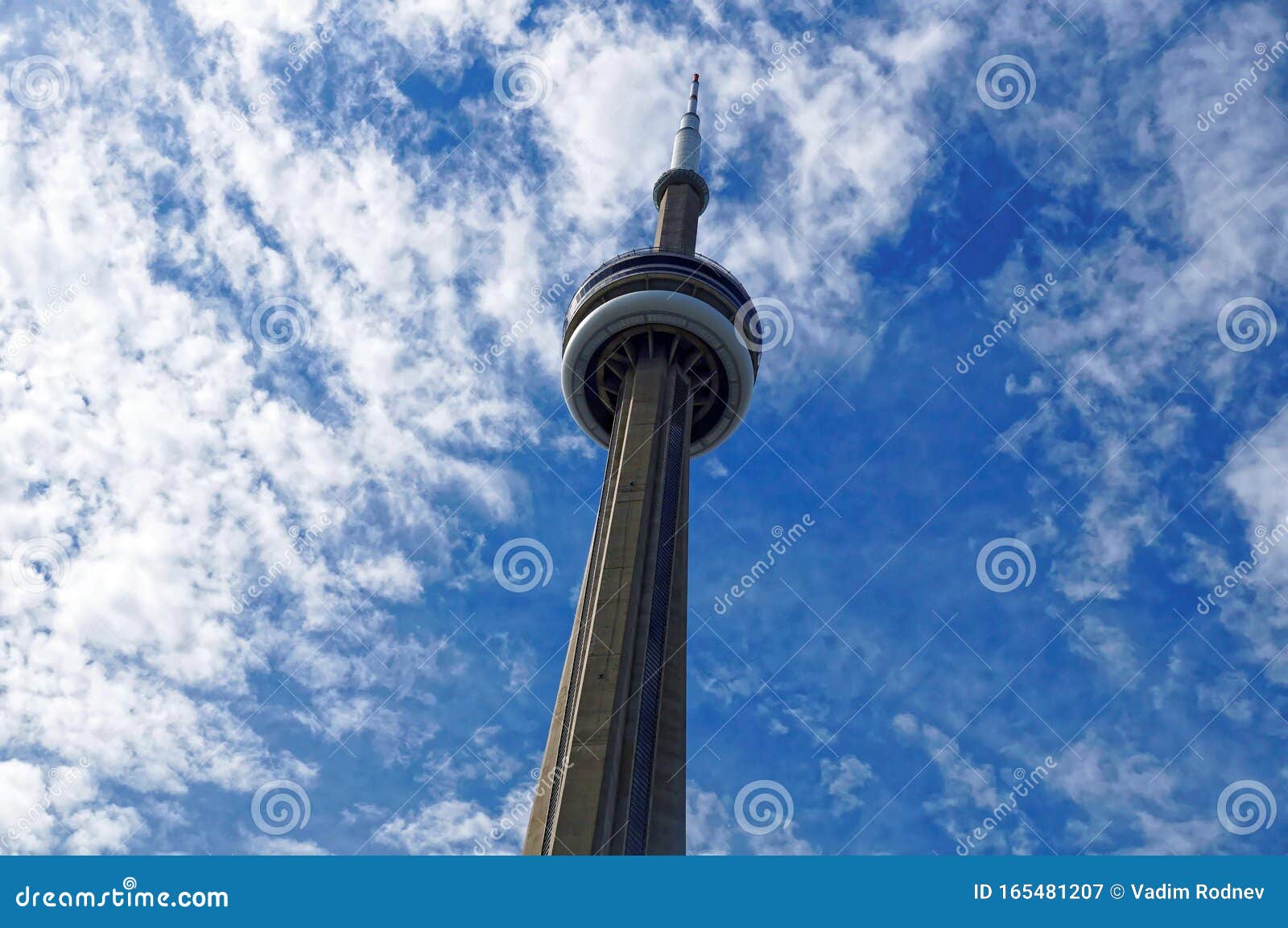 Toronto Needle. CN Tower Spire Piercing Blue Sky of Toronto Editorial ...
