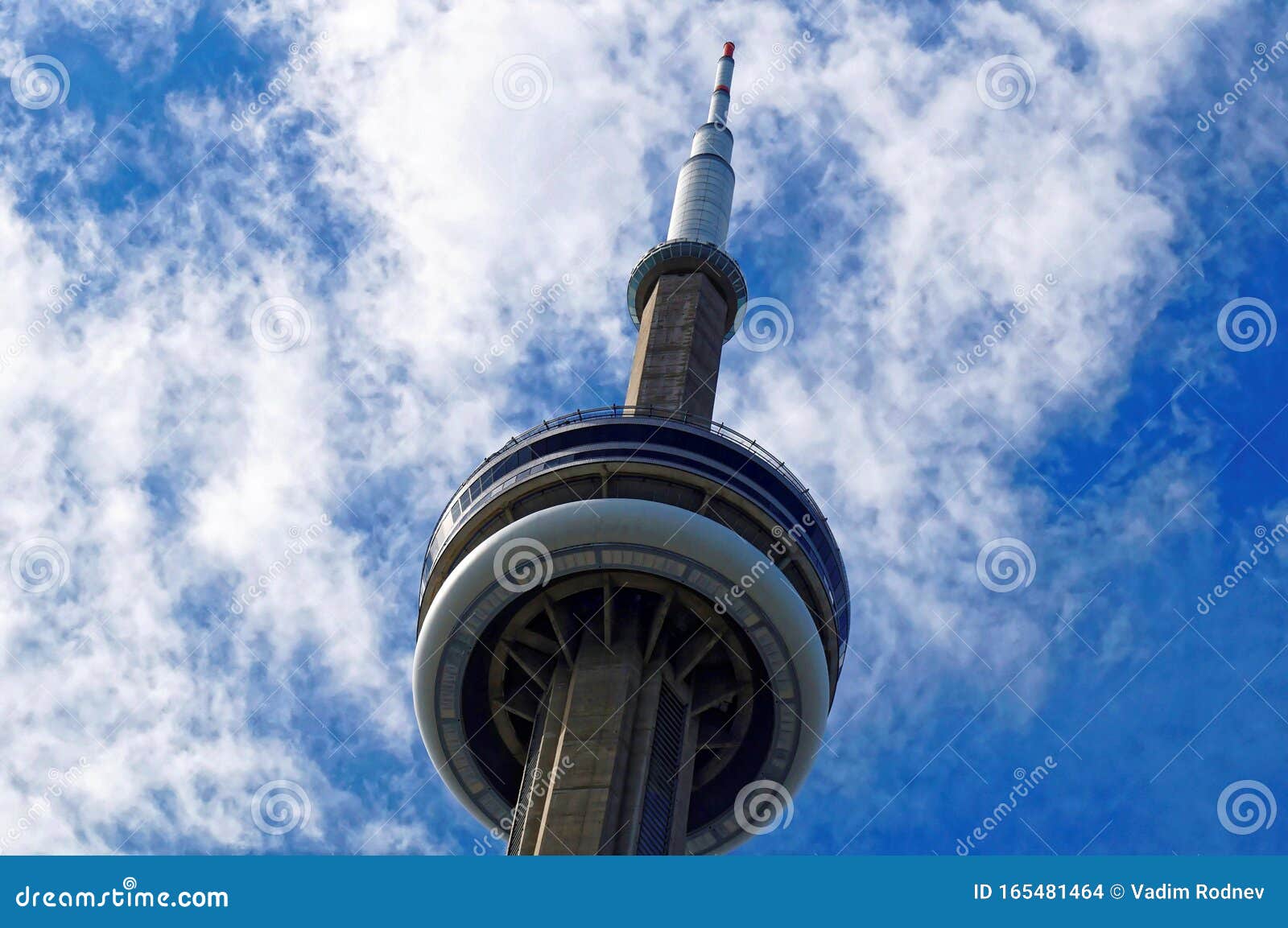 Toronto Needle. CN Tower Spire Piercing Blue Sky of Toronto Editorial ...