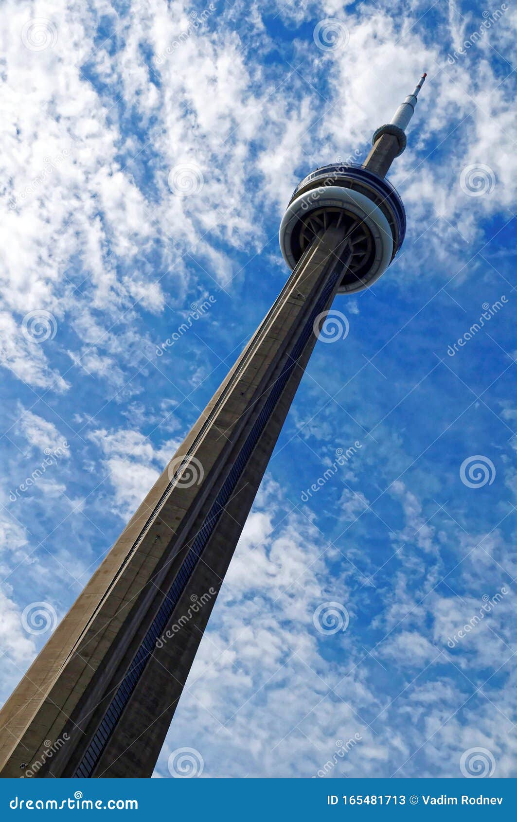 Toronto Needle. CN Tower Spire Piercing Blue Sky of Toronto Editorial ...