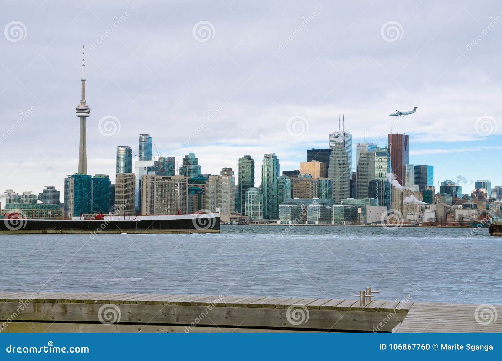 Toronto Skyline View from Toronto Island with a Plane Flying Editorial ...