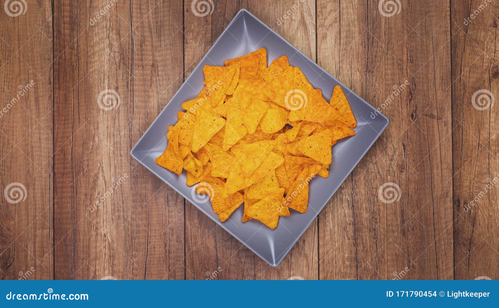 Tortilla Chips Filling a Rotating Rectangular Plate - Stop Motion Stock ...