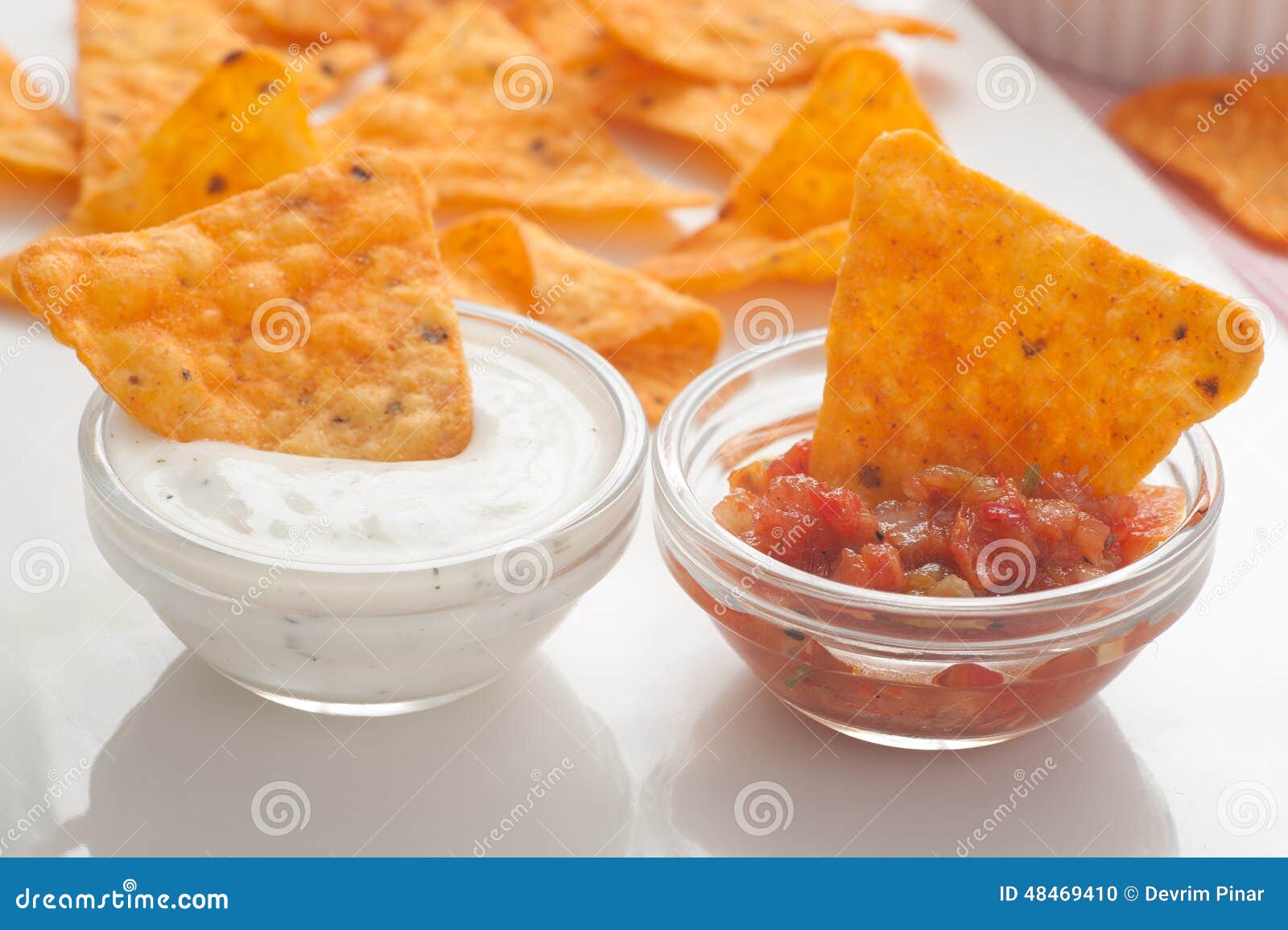 Tortilla chips in sauce stock photo. Image of spicy, delicious - 48469410