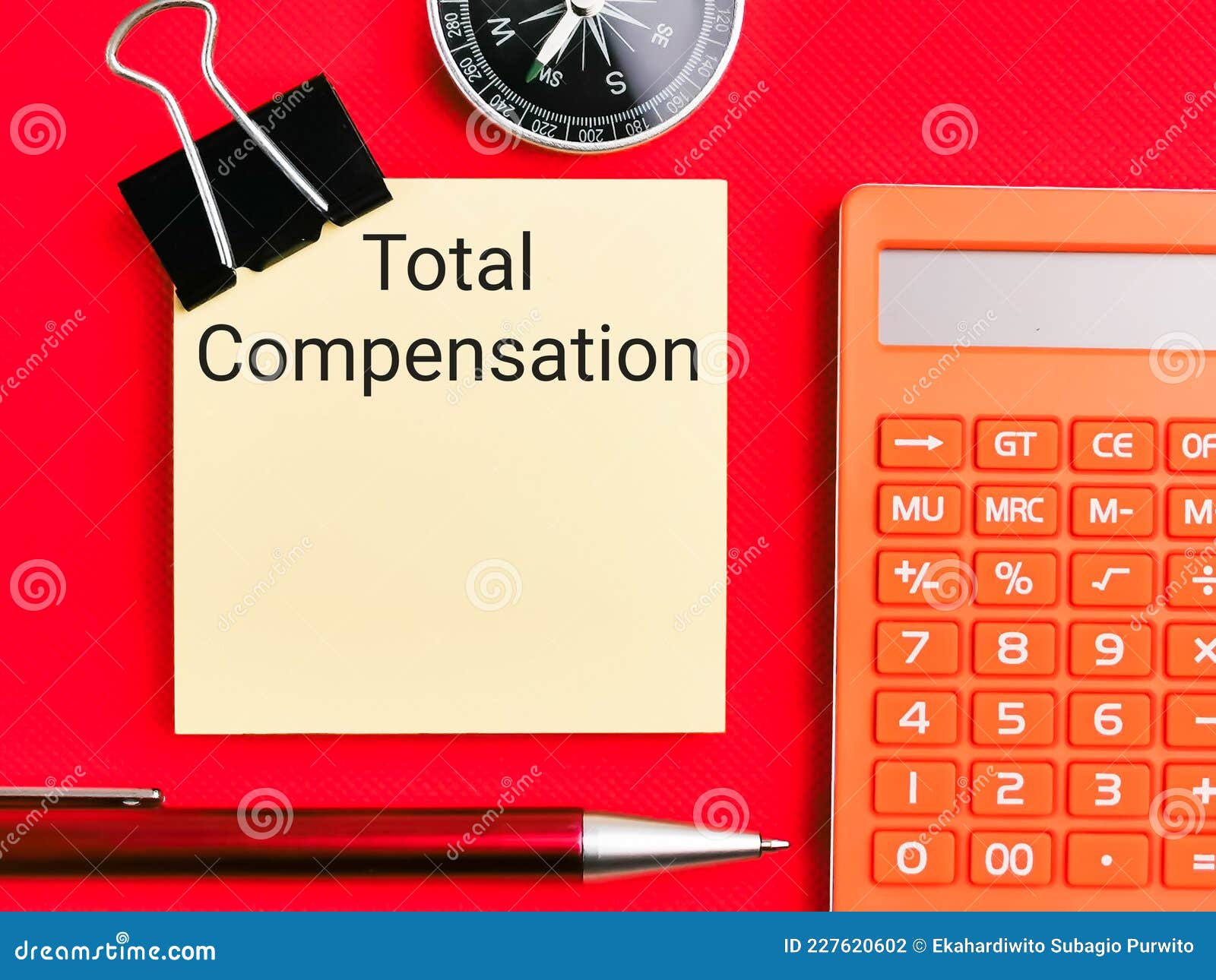 Total Compensation Written on Sticky Note with a Pen,compass and ...