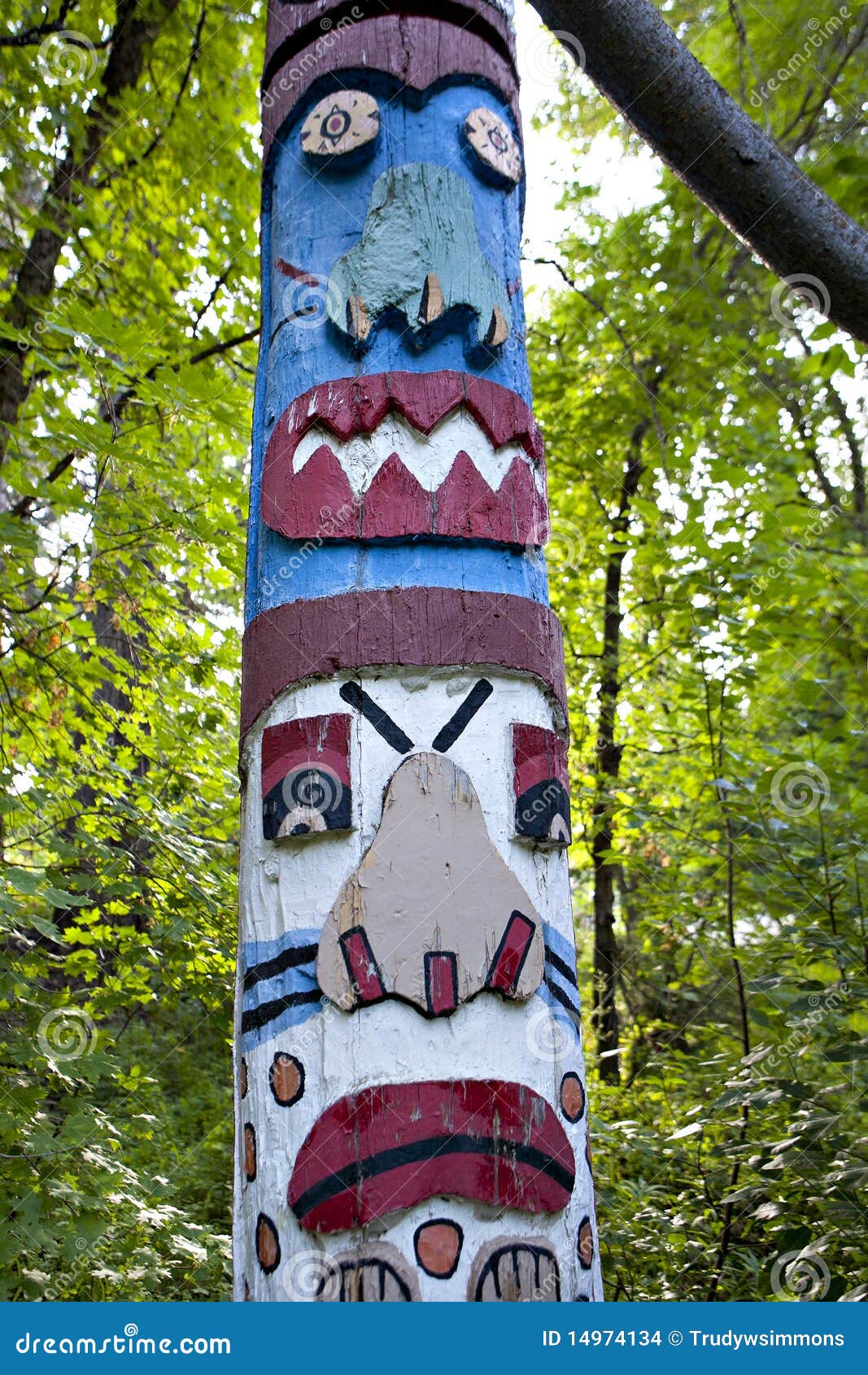 Totem Pole in the Forest stock photo. Image of painted - 14974134