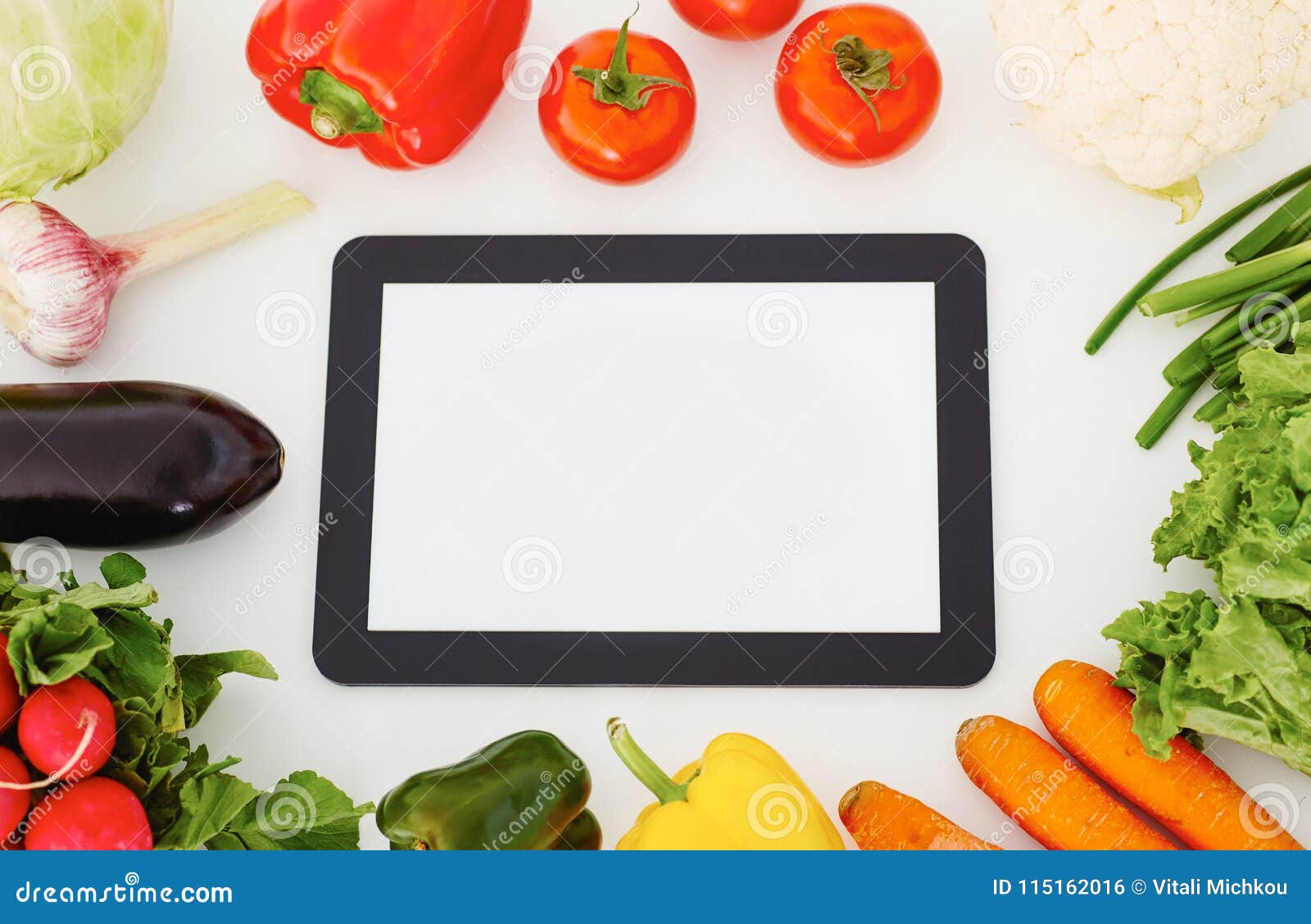 Touch Screen Digital Tablet, Fresh Vegetables and Grass on a White ...