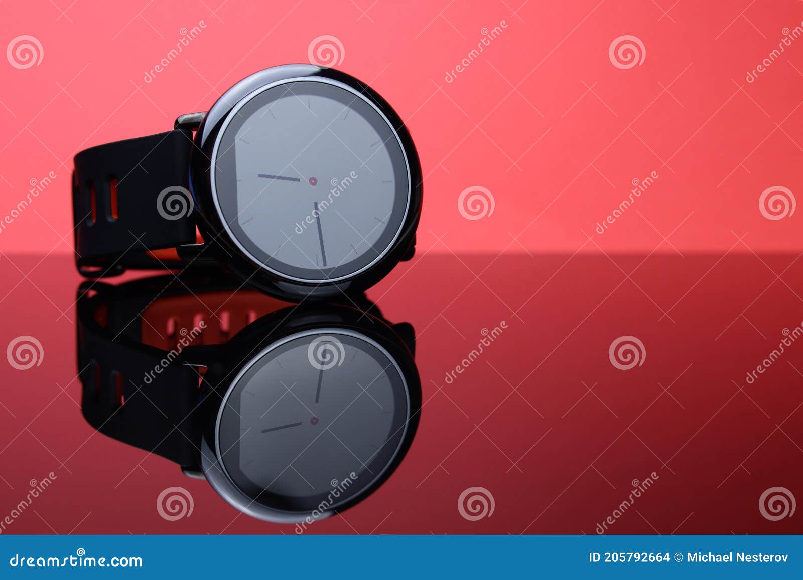 Touch Smartwatch with Round Display on Mirror Red Surface Stock Photo ...