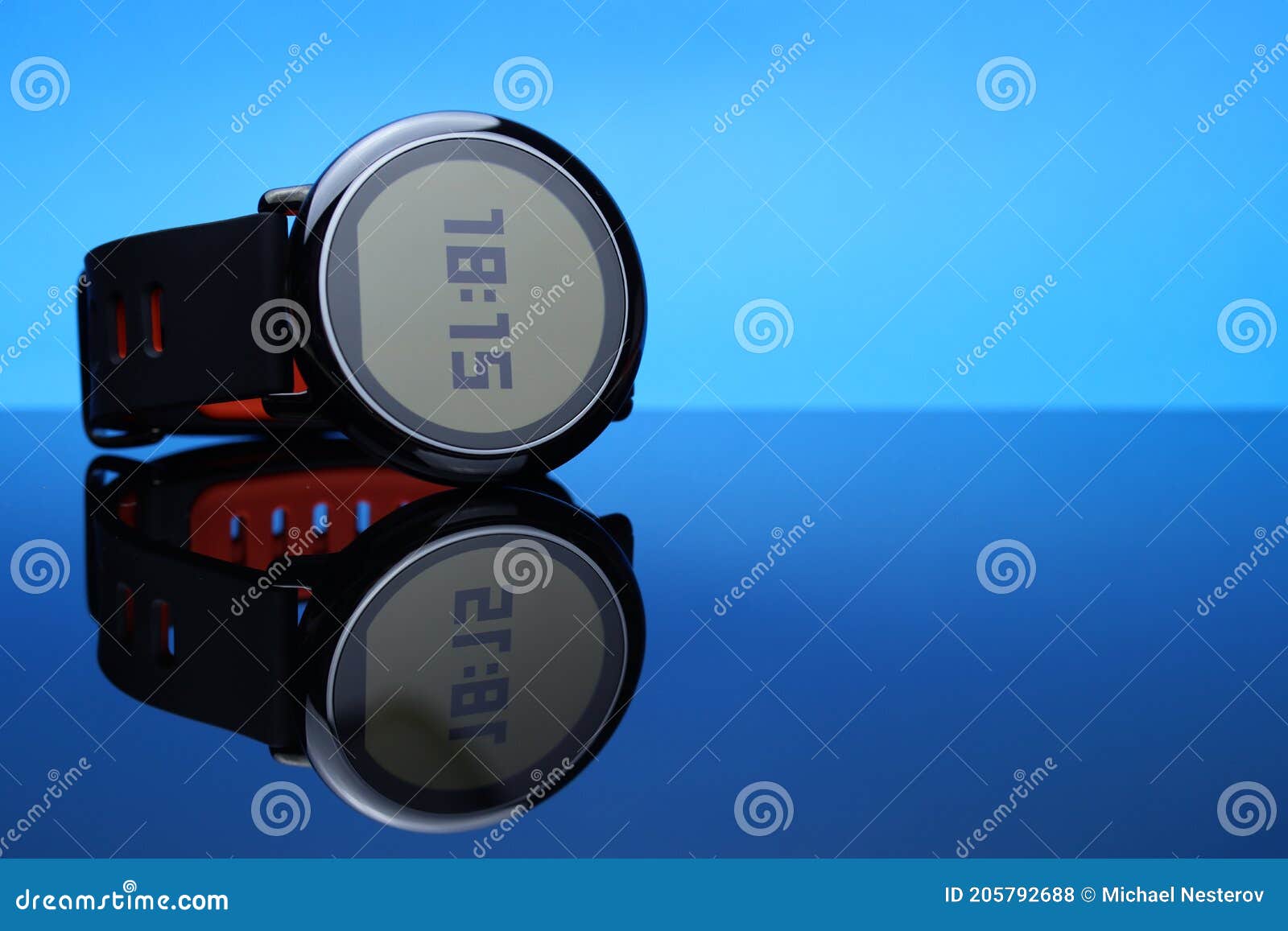 Touch Smartwatch with a Round Display on a Mirrored Blue Surface Stock ...