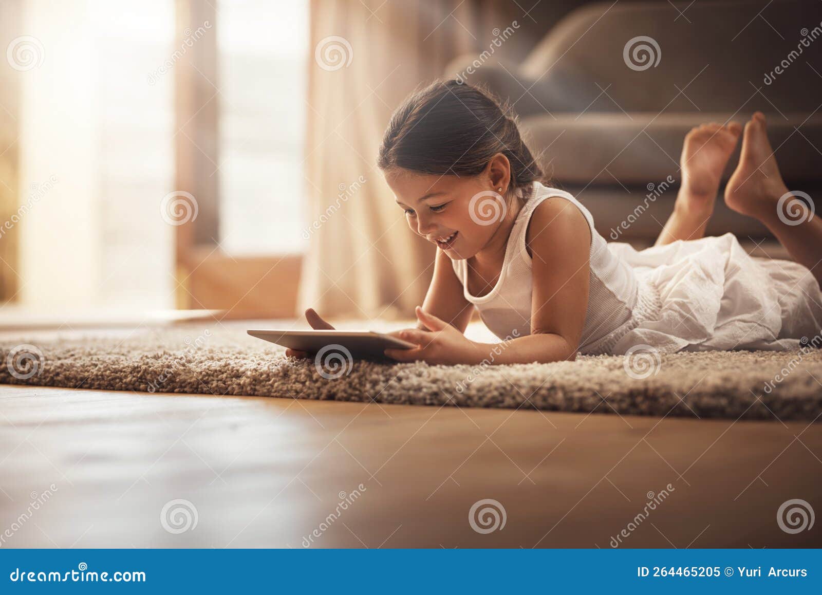 In Touch with Touchscreen Tech. an Adorable Little Girl Using a Digital ...