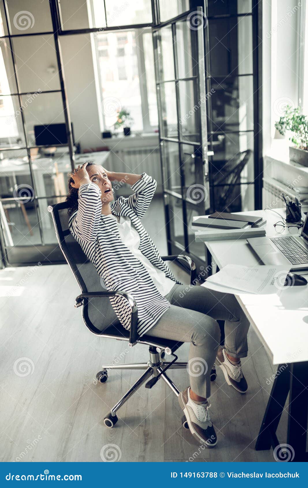 Young Trainee Touching Her Head while Feeling Tired after Work Stock ...