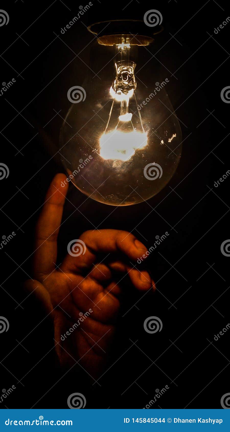 Touching light stock photo. Image of light, dark, bulb - 145845044